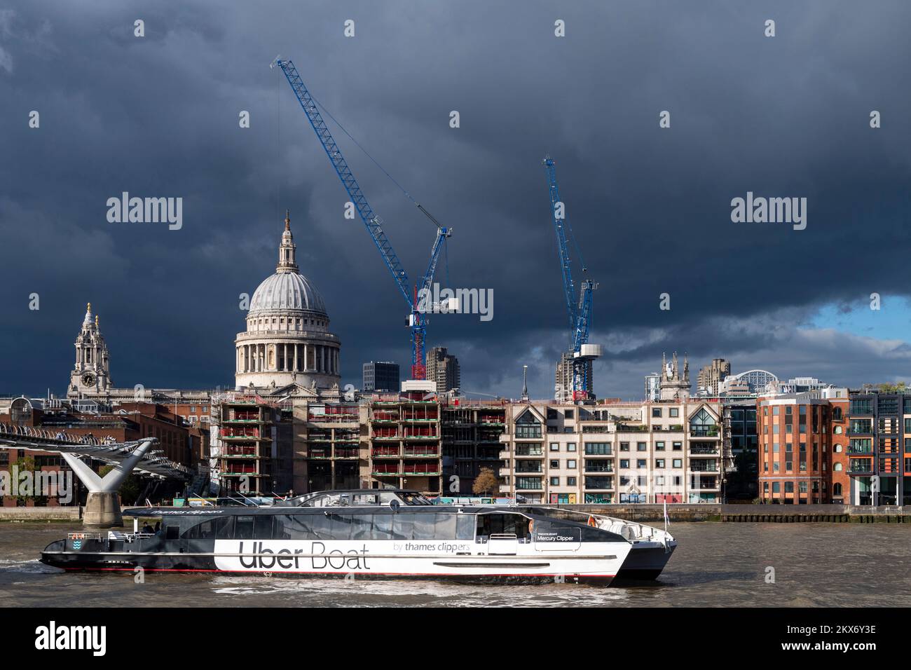 An Uber Boat by Thames Clippers, river bus coming under the Millennium ...