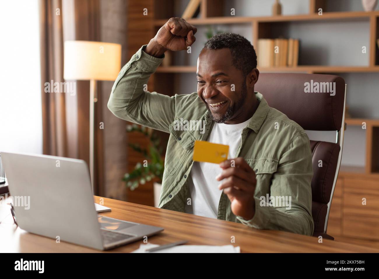 Happy middle aged african american businessman make victory and success ...