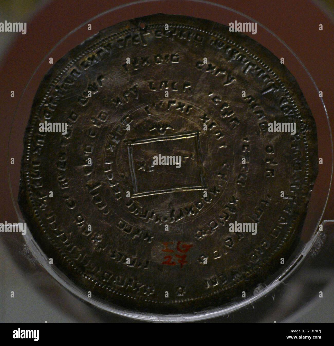 Silver amulet in the shape of a disc, 15th century. The laudatory Psalm ...