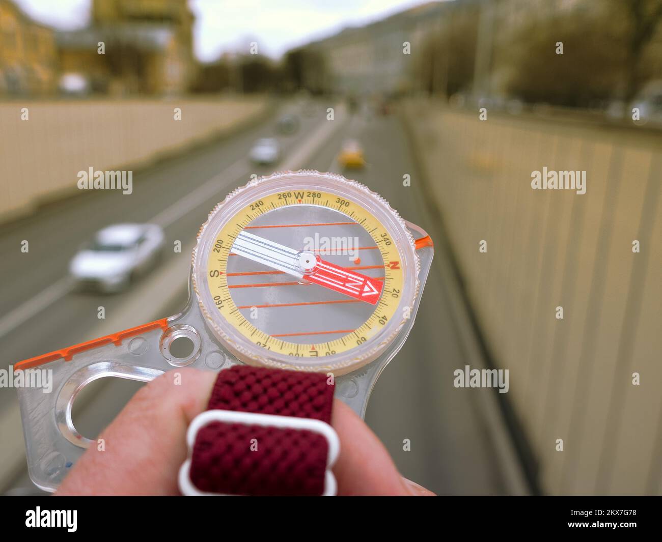 A compass in a person's hand. Orient yourself in the current situation ...