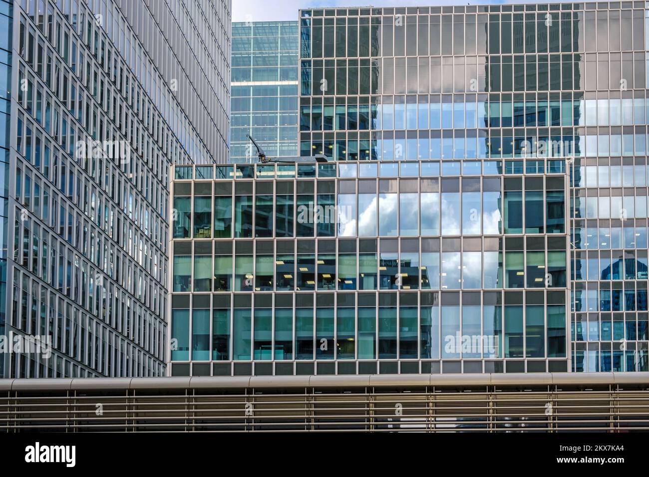 Detail of geometric skyscrapers with reflective, rectangle windows at ...