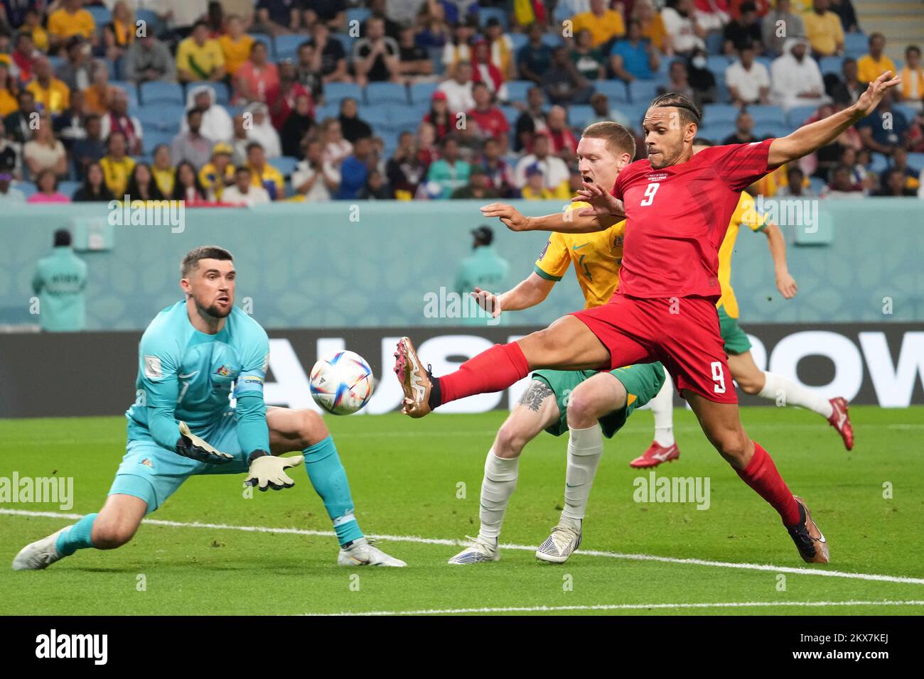 Al Wakrah, Qatar. 30th Nov, 2022. Martin Braithwaite (R) of Denmark ...