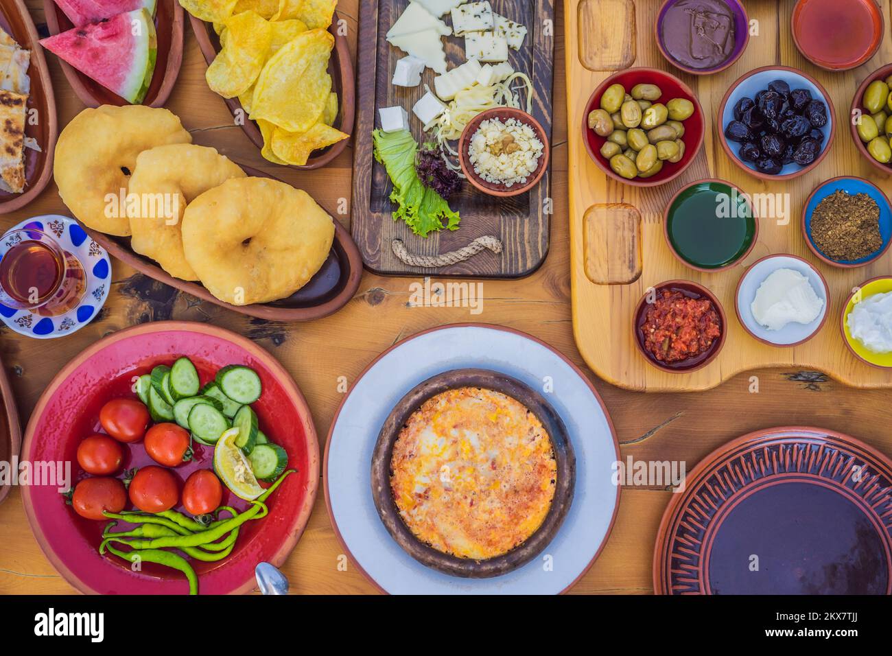 Turkish breakfast table. Pastries, vegetables, greens, olives, cheeses ...
