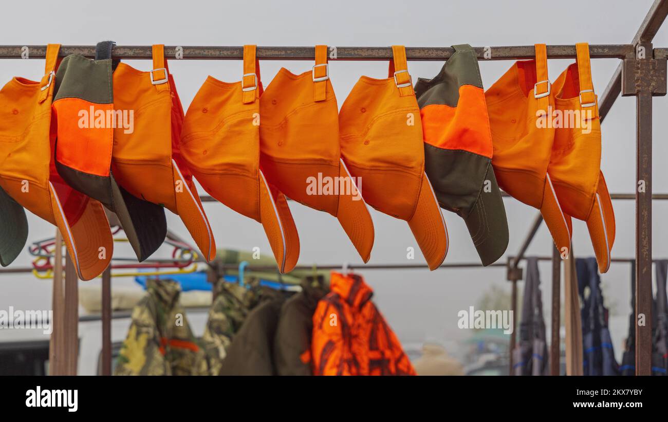 Hi Vis Neon Orange Hats for Safety Hunting Stock Photo - Alamy