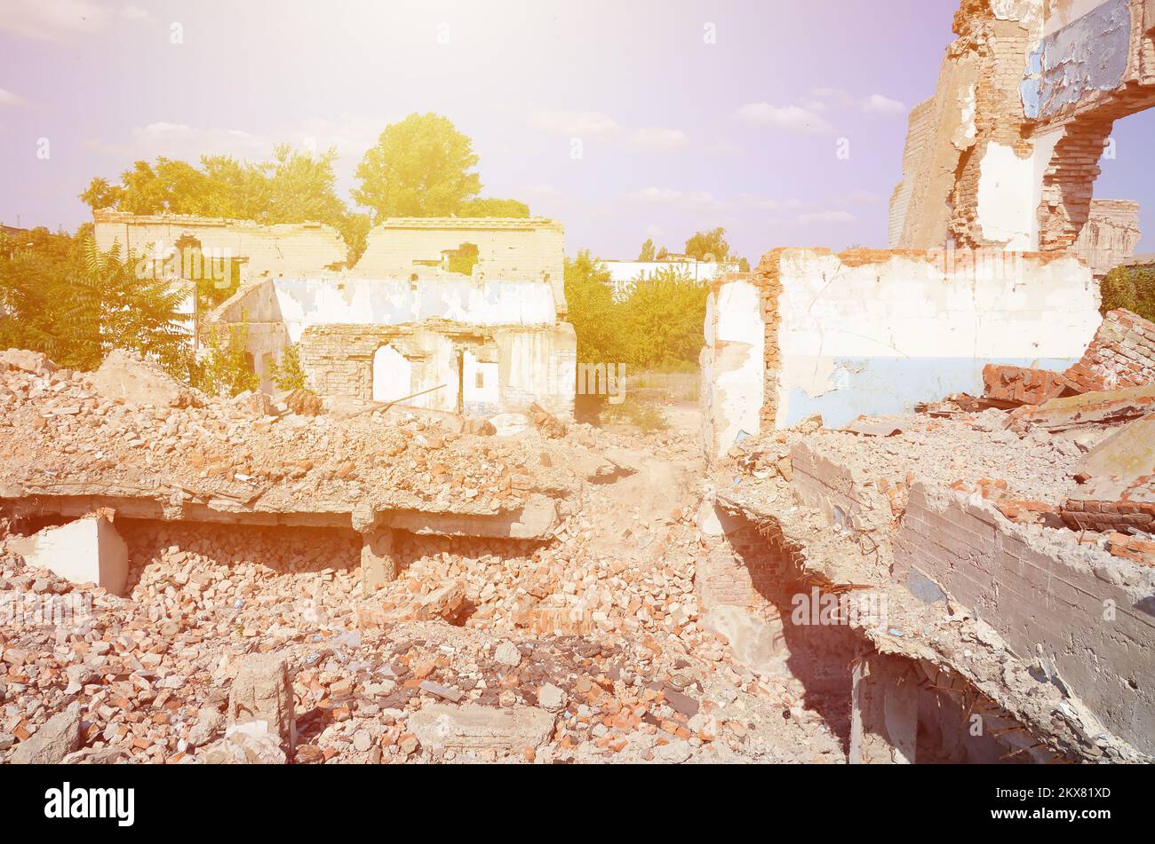 Collapsed industrial multistorey building in daytime. Disaster scene ...