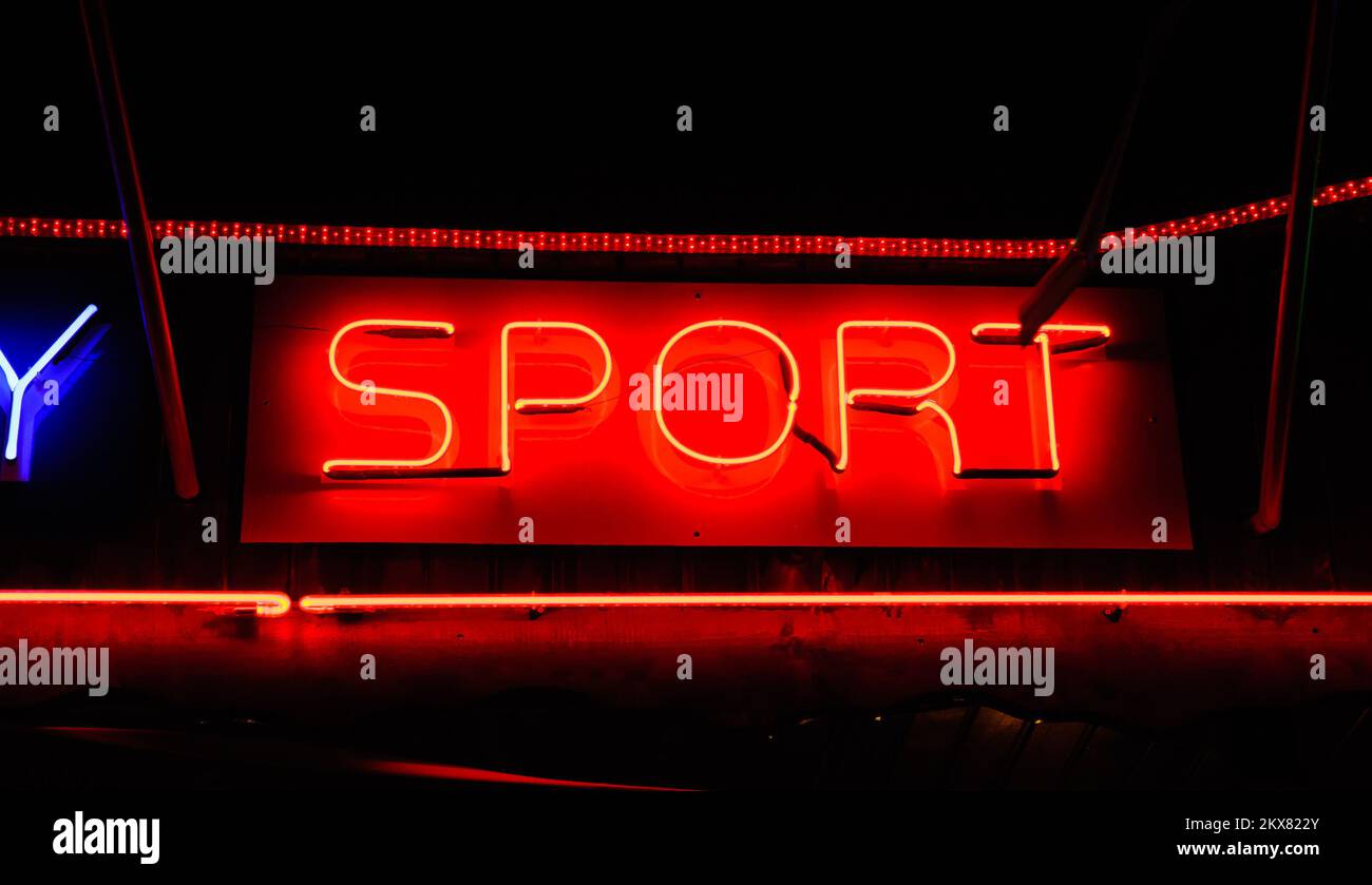 Neon shining signboard at night Stock Photo - Alamy