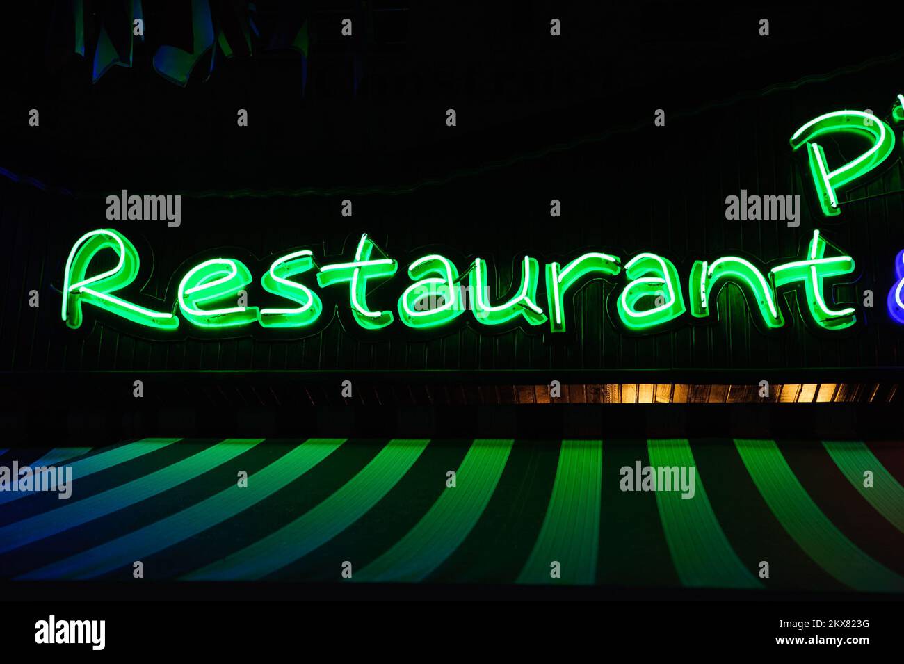 Neon shining signboard at night Stock Photo - Alamy