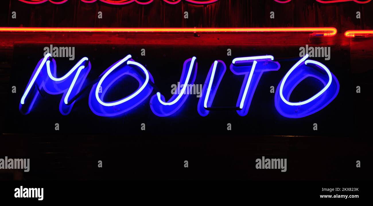 Neon shining signboard at night Stock Photo - Alamy