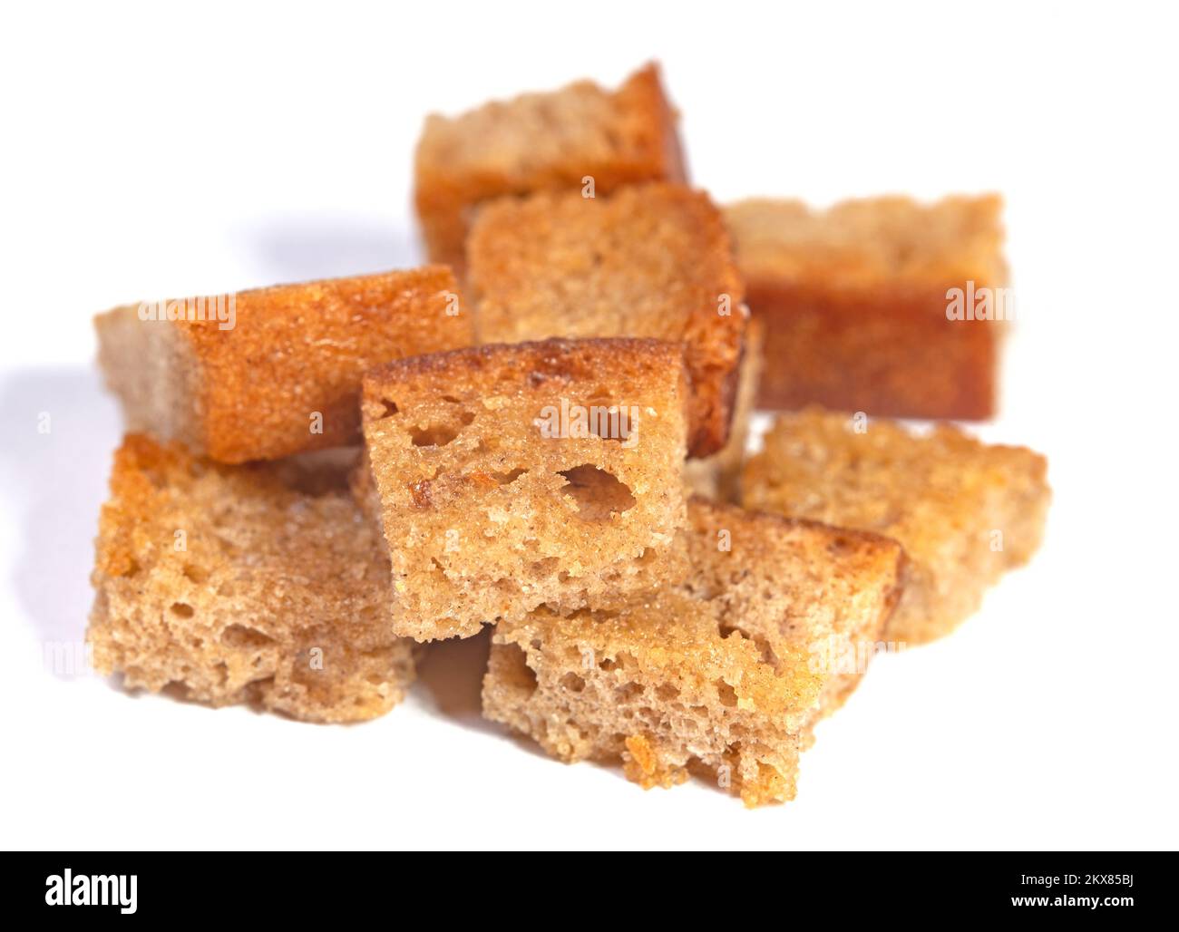 Toasted bread cubes against white background Stock Photo - Alamy
