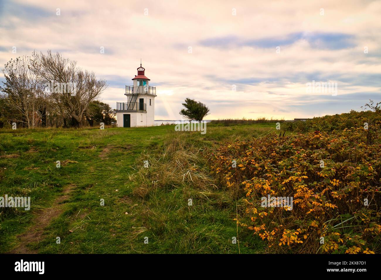 Lighthouse, Spodsbjerg Fyr in Huntsted on the coast of Denmark. Sun ...