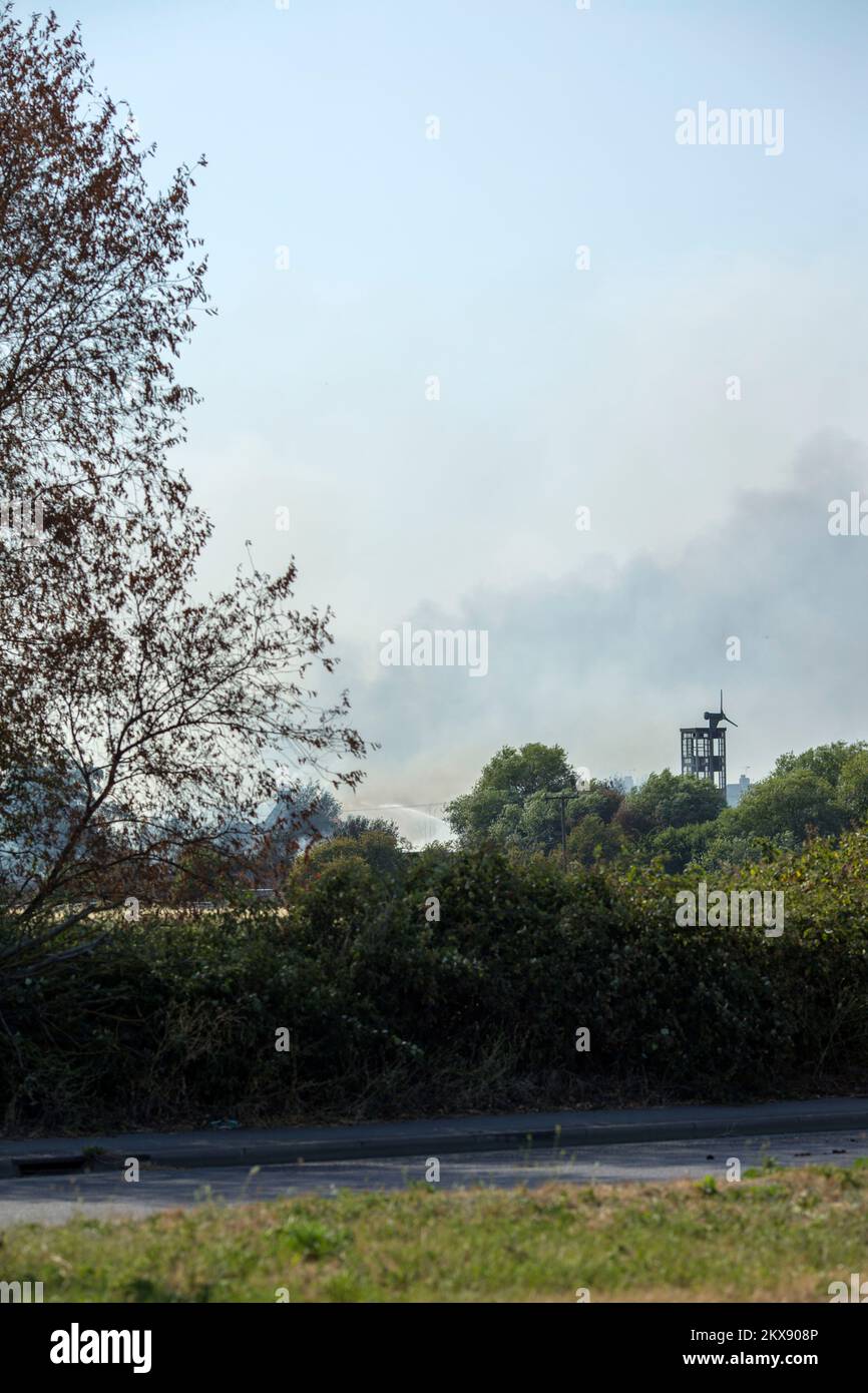 Smoke from a fire is seen in Wennington, east London, as the UK ...