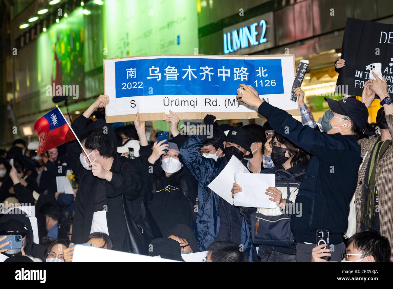 Tokyo, Japan. 30th Nov, 2022. Protesters with road signs for ÃœrÃ¼mqi ...