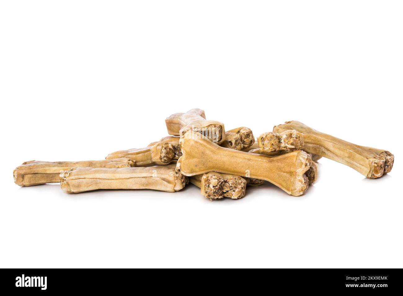 Bone food for dogs isolated on white Stock Photo - Alamy