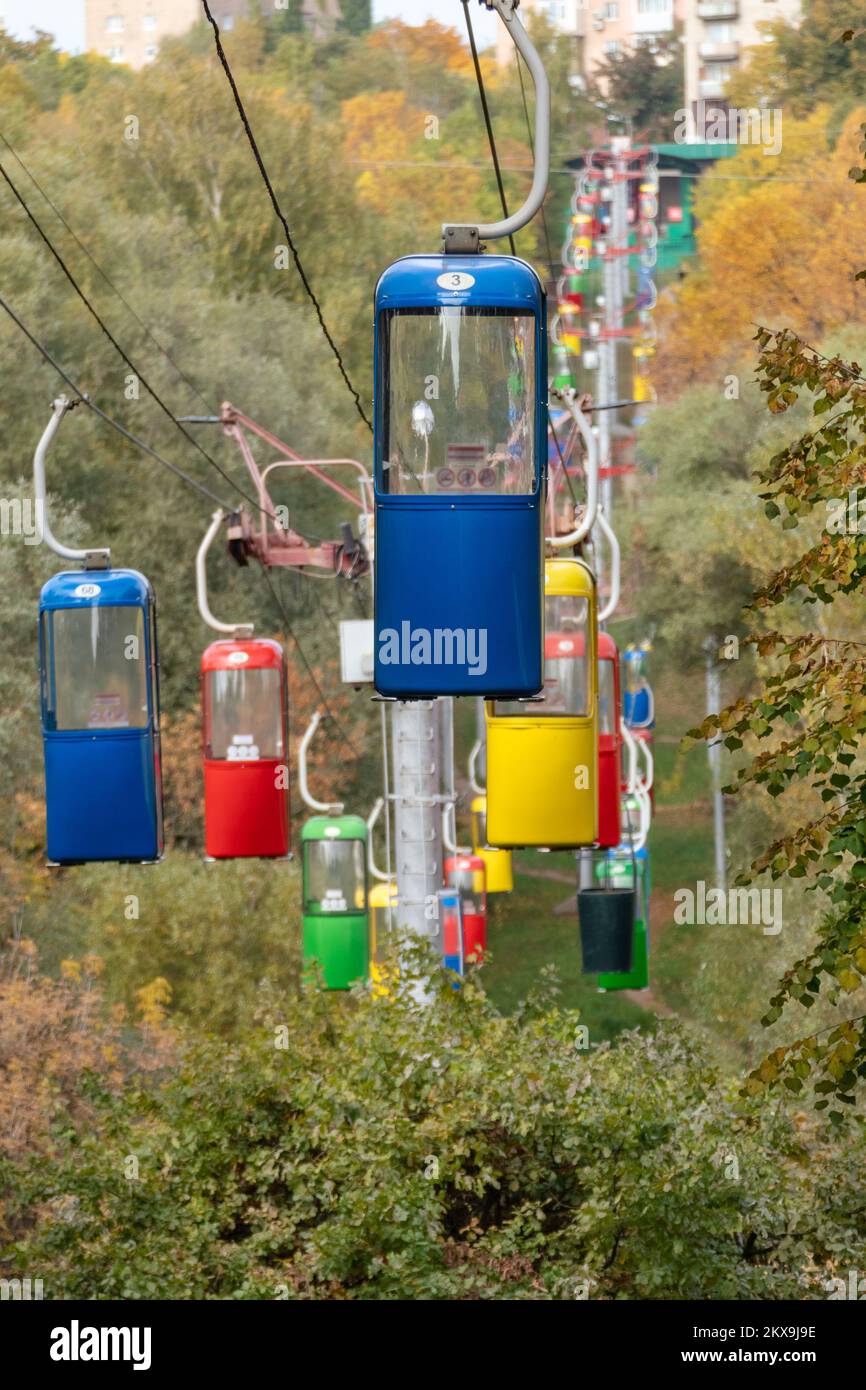 Colorful cableway transport cabins in Kharkiv city amusement park with ...