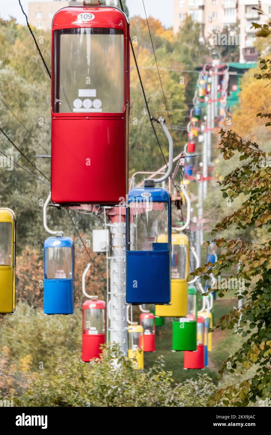 Vibrant cableway transport cabins in Kharkiv city amusement park with ...