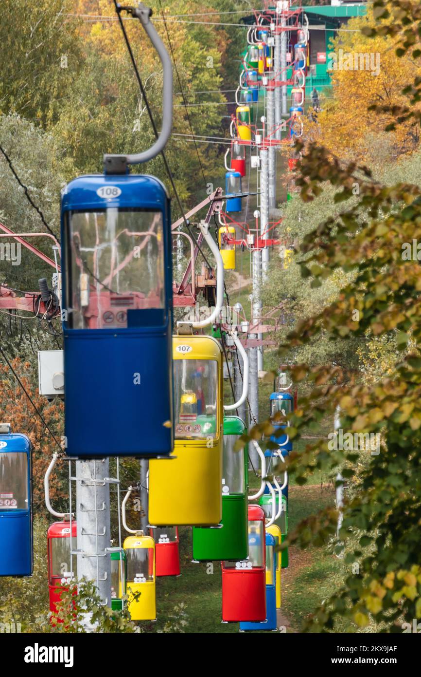 Cableway transport cabins in Kharkiv city center park with autumn ...