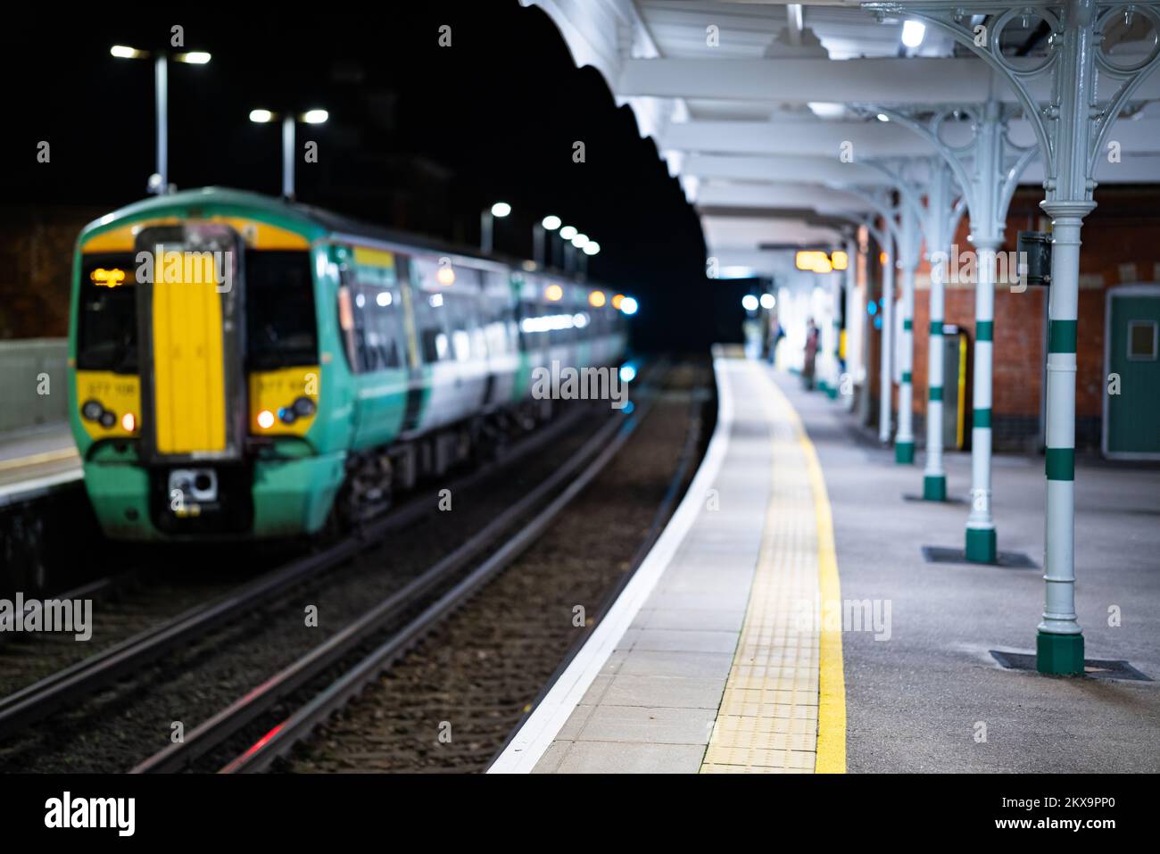 Night scene at small rural train station in West Sussex, England. UK ...