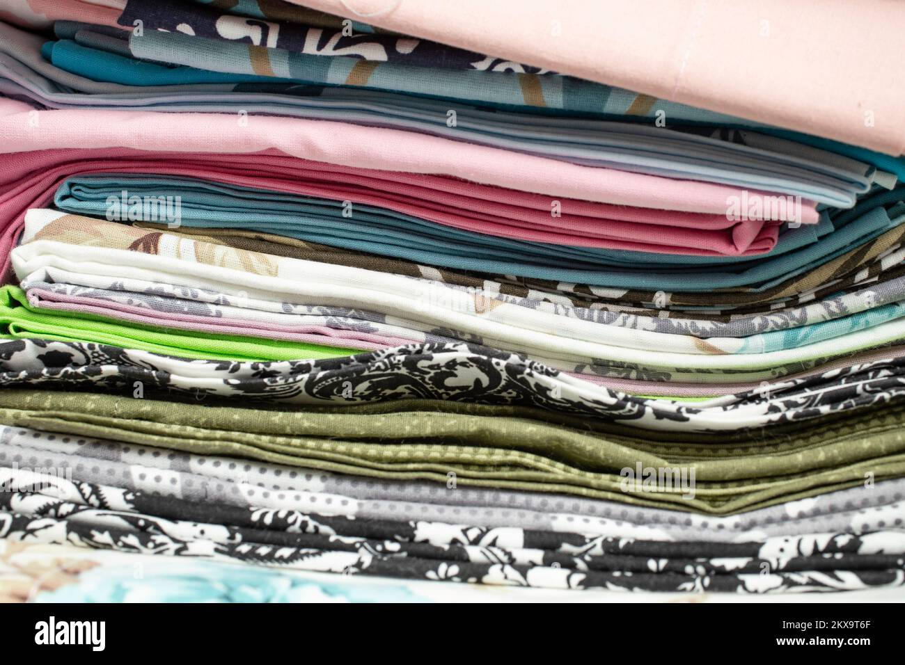 many colored fabric folds stacked. Soft focus close up Stock Photo - Alamy