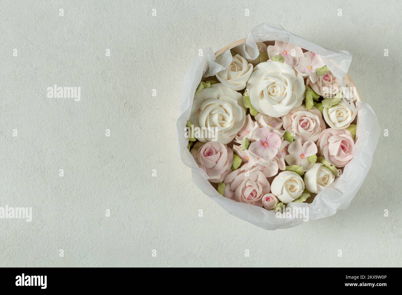 Zephyr bouquet of flowers in a pink box on a gray background Stock ...