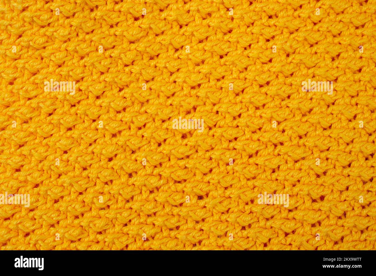 Yellow crochet pattern, close up texture backdrop Stock Photo - Alamy