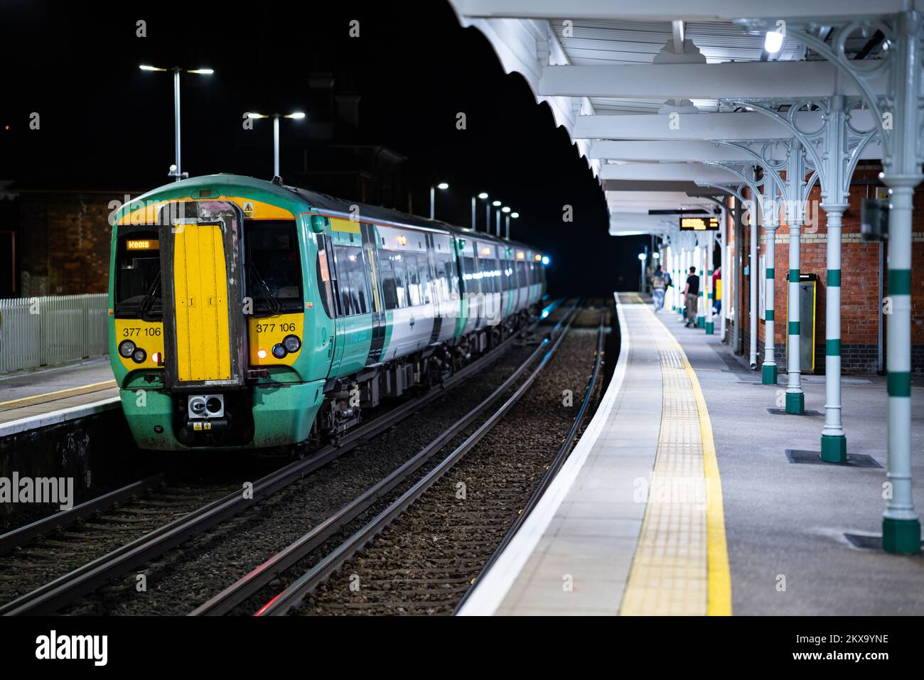 Night scene at small rural train station in West Sussex, England. UK ...