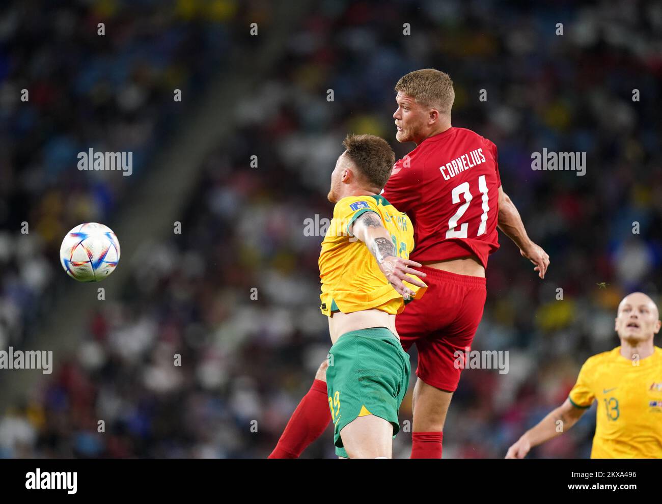 Australia's Harry Souttar (left) and Denmark's Andreas Cornelius battle ...