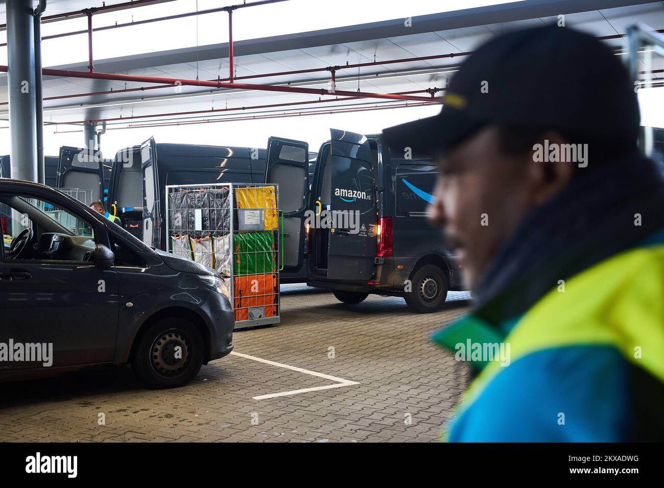 ROZENBURG - Amazon drivers load their packages into the car at the ...