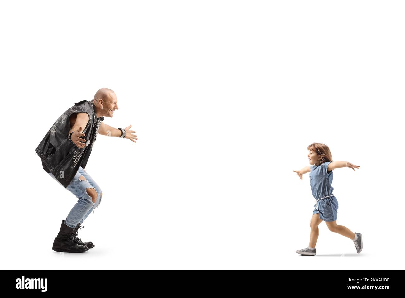 Full length profile shot of a little girl running to hug a rock music ...