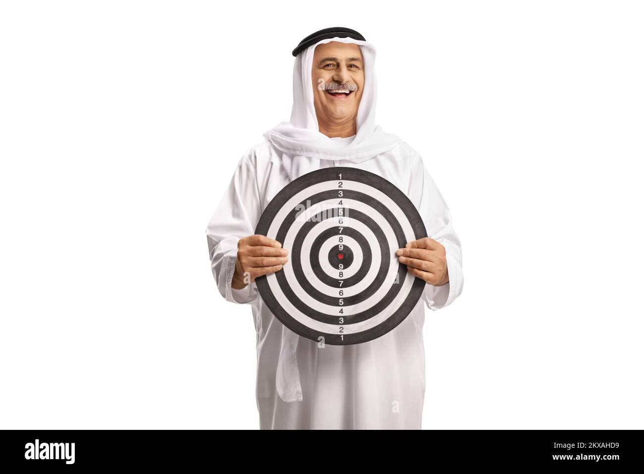 Smiling arab man in a white robe holding a dart board isolated on white ...