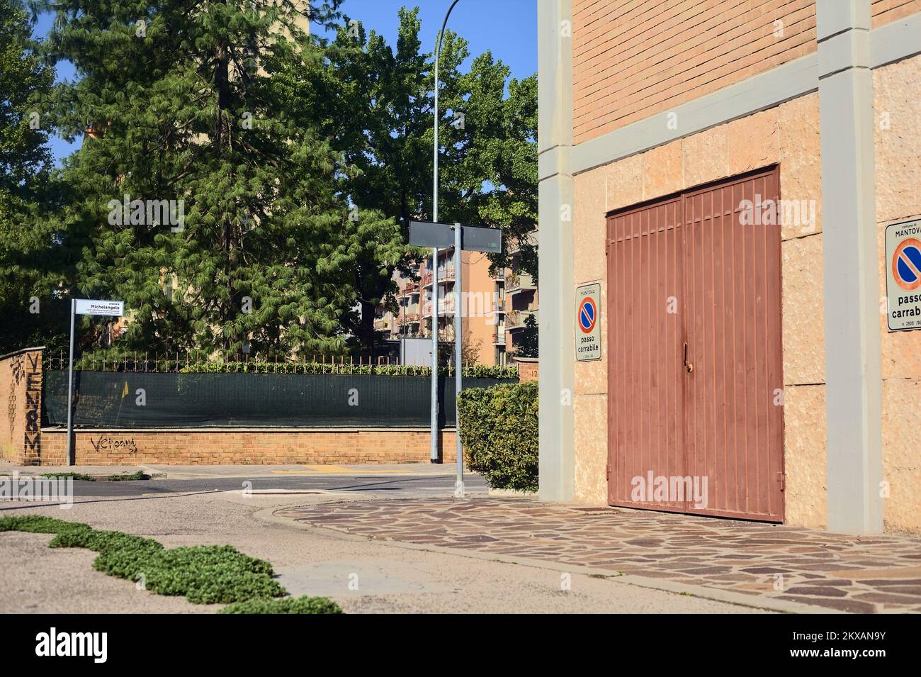 Corner of a street with garage doors in a residential area in an ...