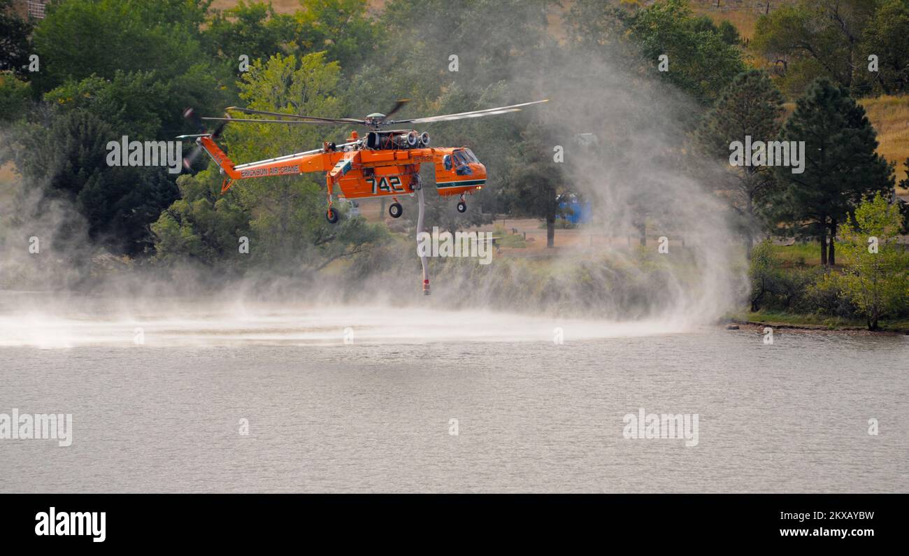 Firefighting helicopter hovering over hi-res stock photography and ...