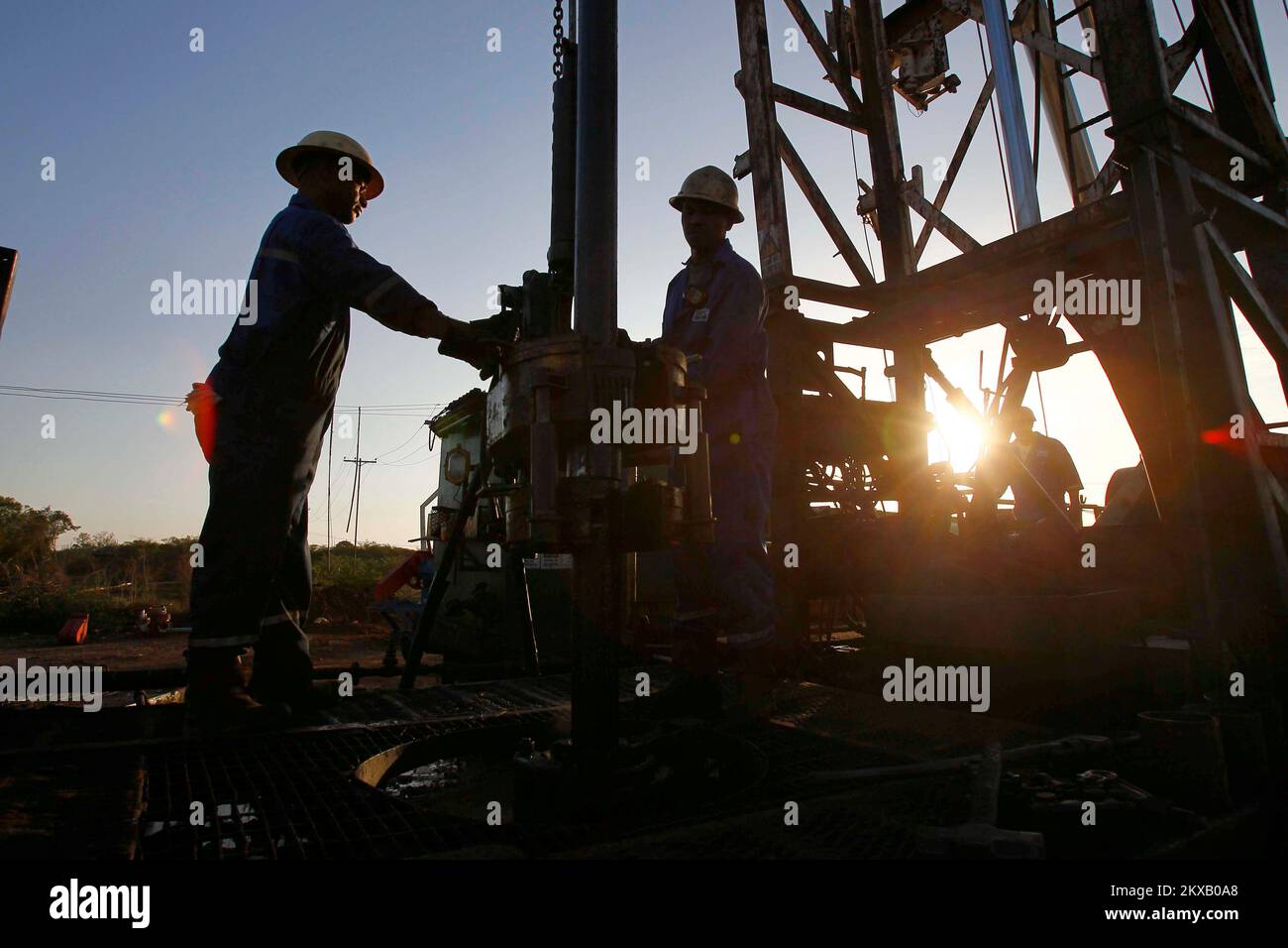 Workers of the State Oil Company of Venezuela, drill a crude well in an ...