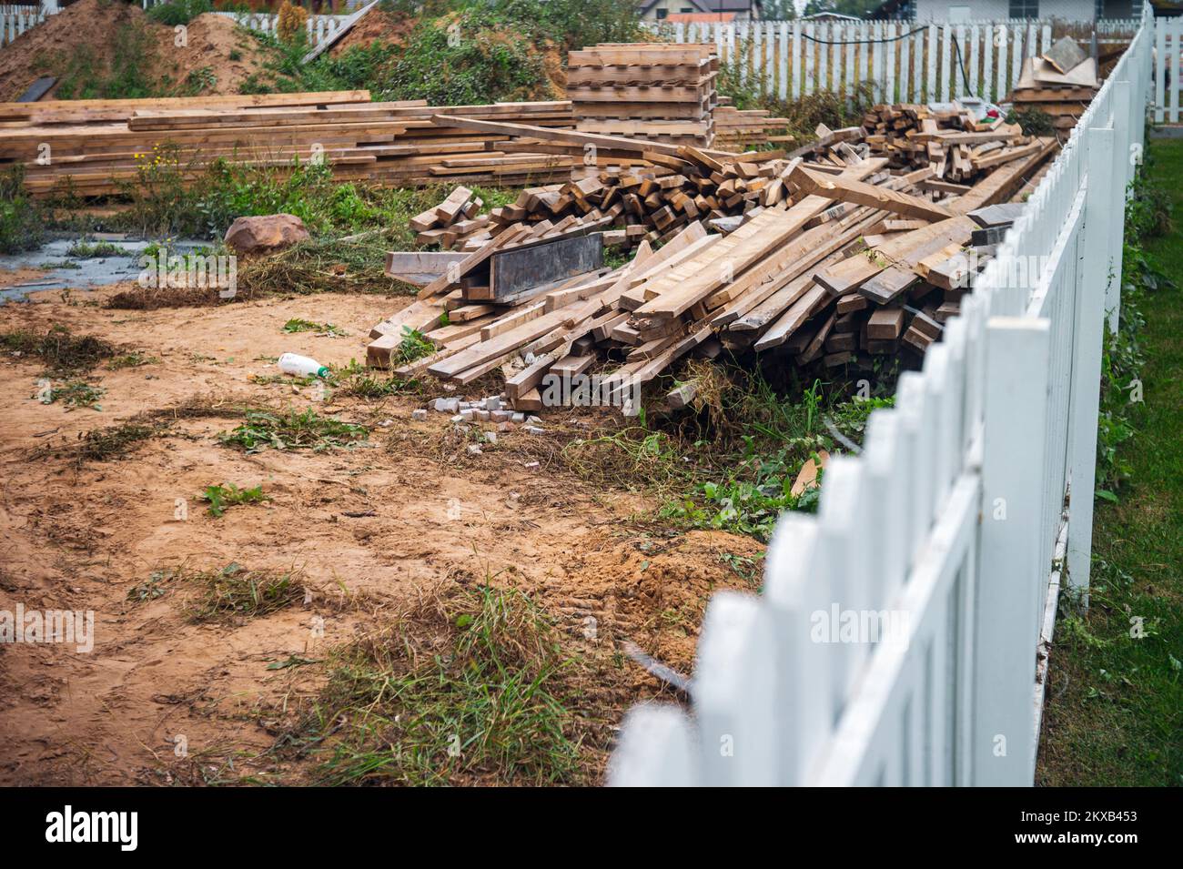 wooden boards abandoned in mess at the construction site, outdoor shot ...