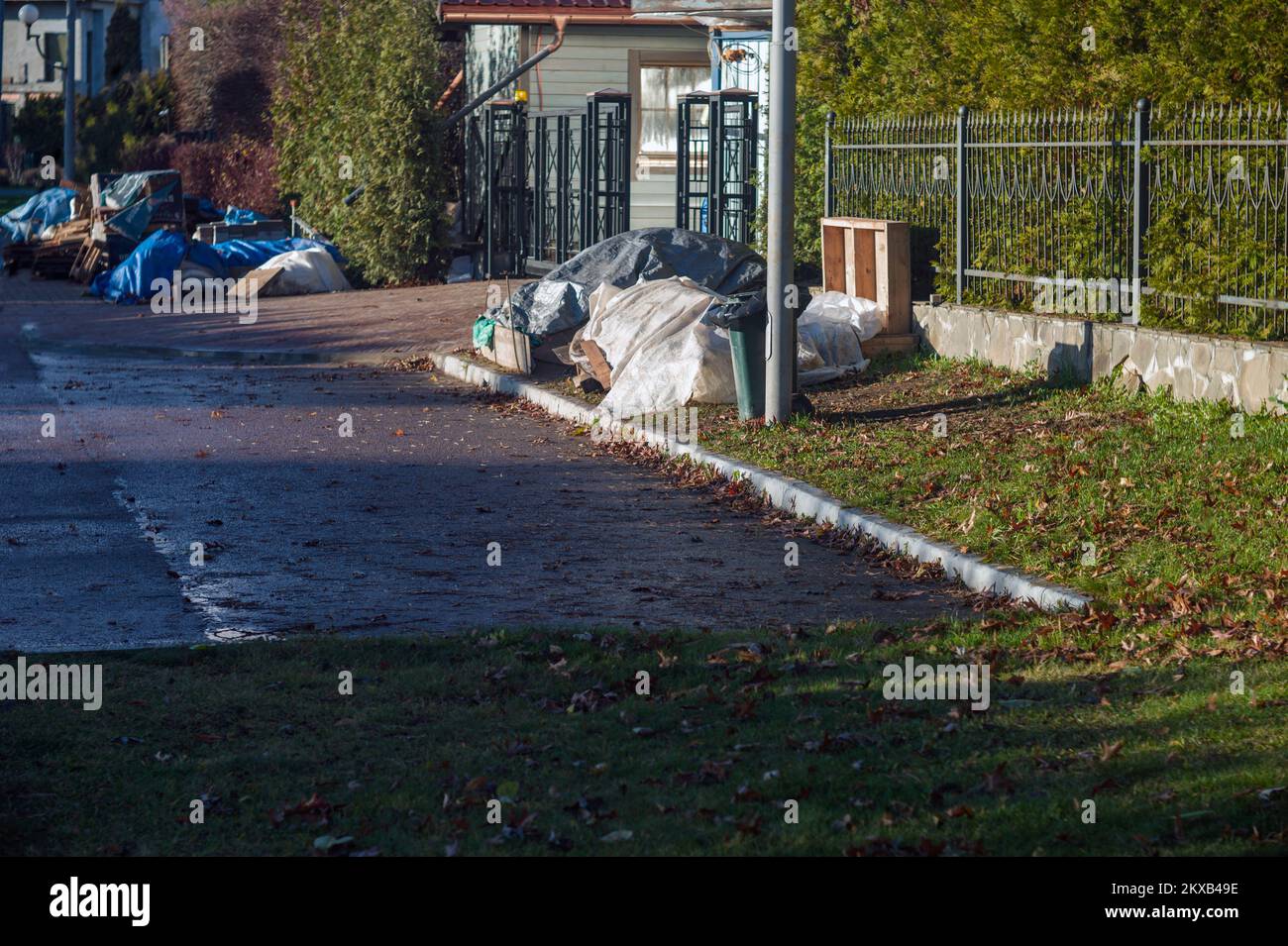 piles of garbage dropped outside after a house renovation, outdoor ...