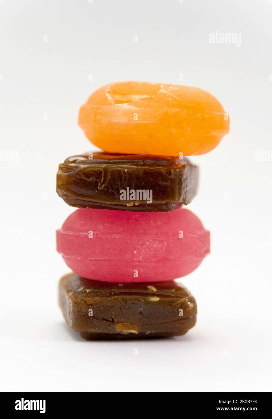 Pile of hard fruit candies isolated on white Stock Photo - Alamy