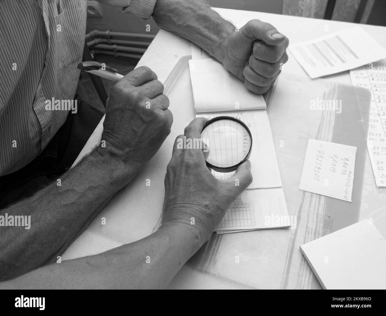 people calculating family budget, using magnifier glass, in black and ...