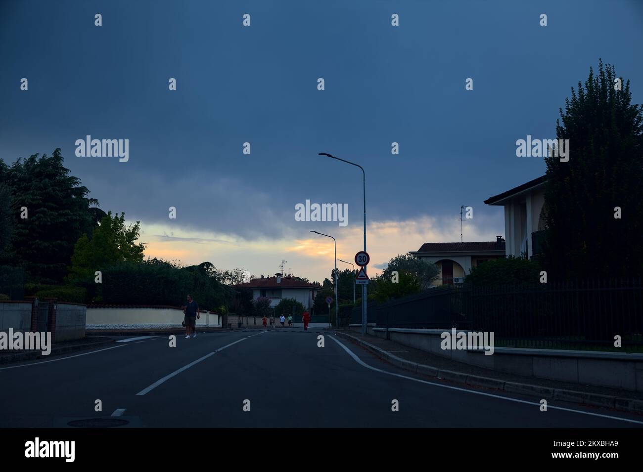 Street in an italian village at sunset Stock Photo - Alamy