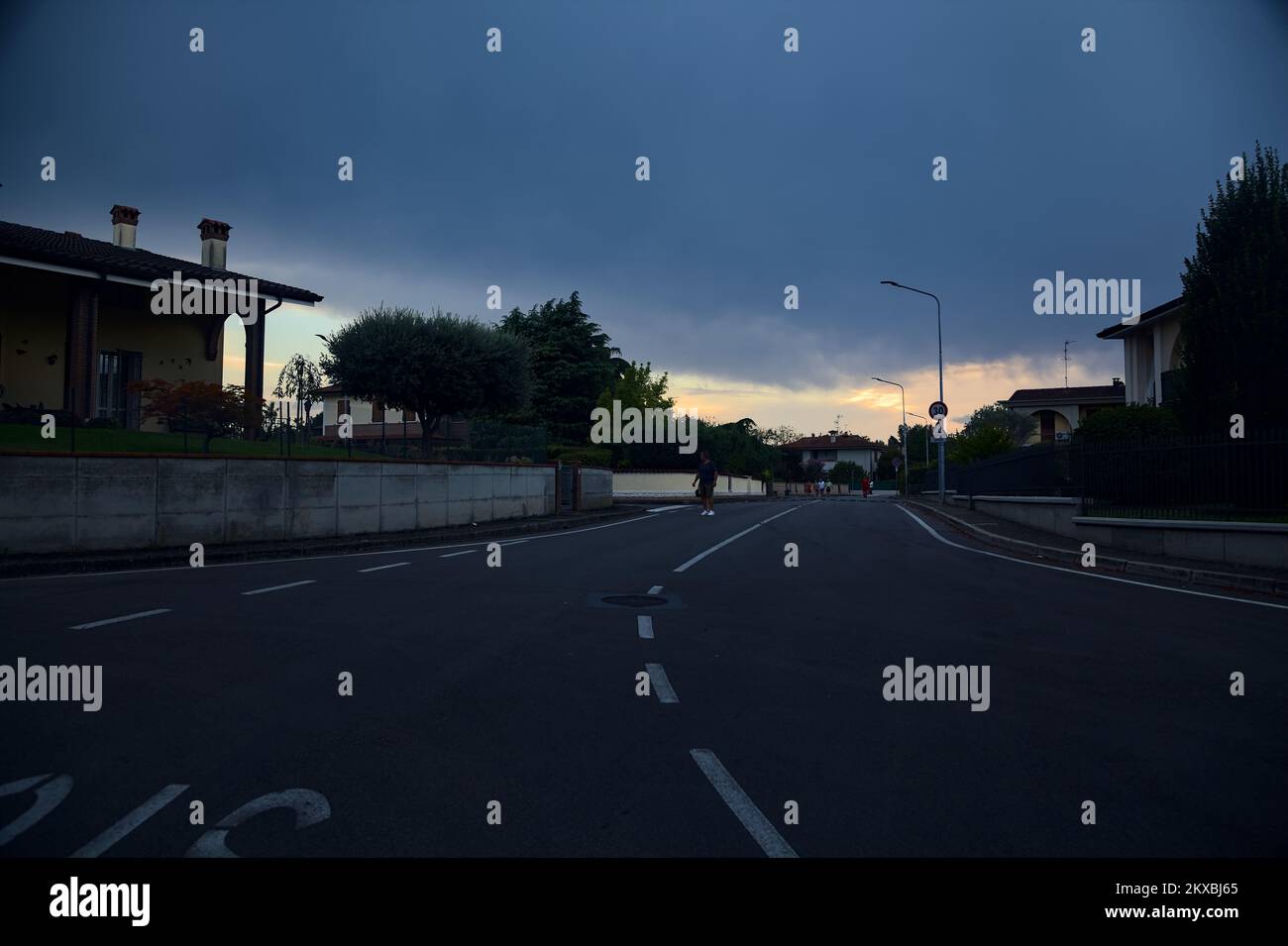 Street in an italian village at sunset Stock Photo - Alamy