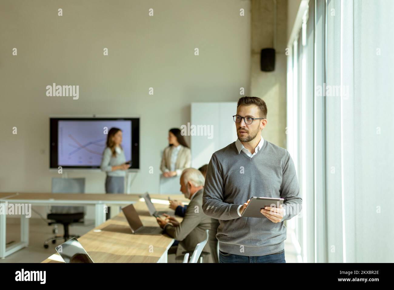 Financial team using digital tablet hi-res stock photography and images ...