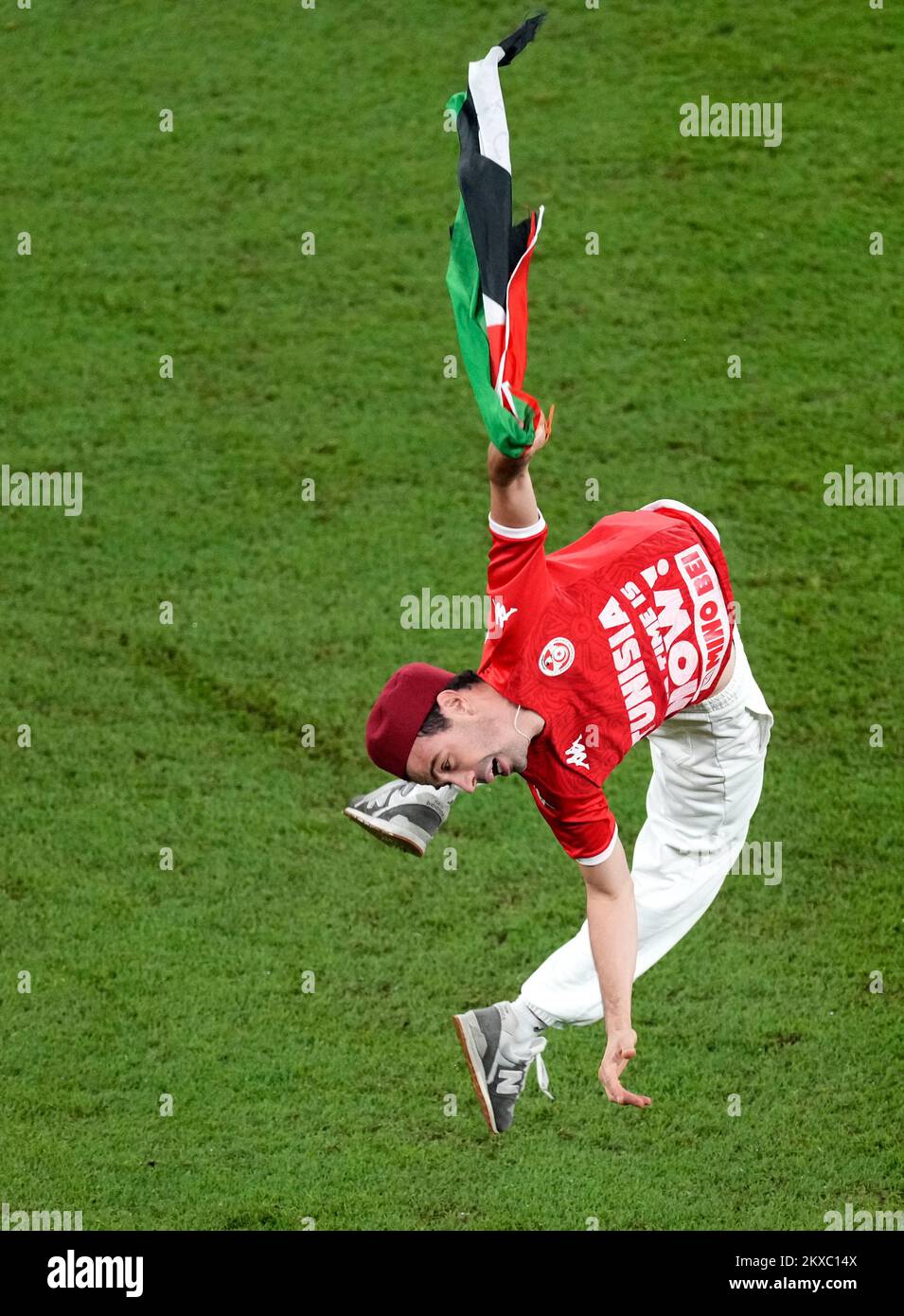 Al Rayyan, Qatar. 30th Nov, 2022. A pitch invader does a flip flop ...