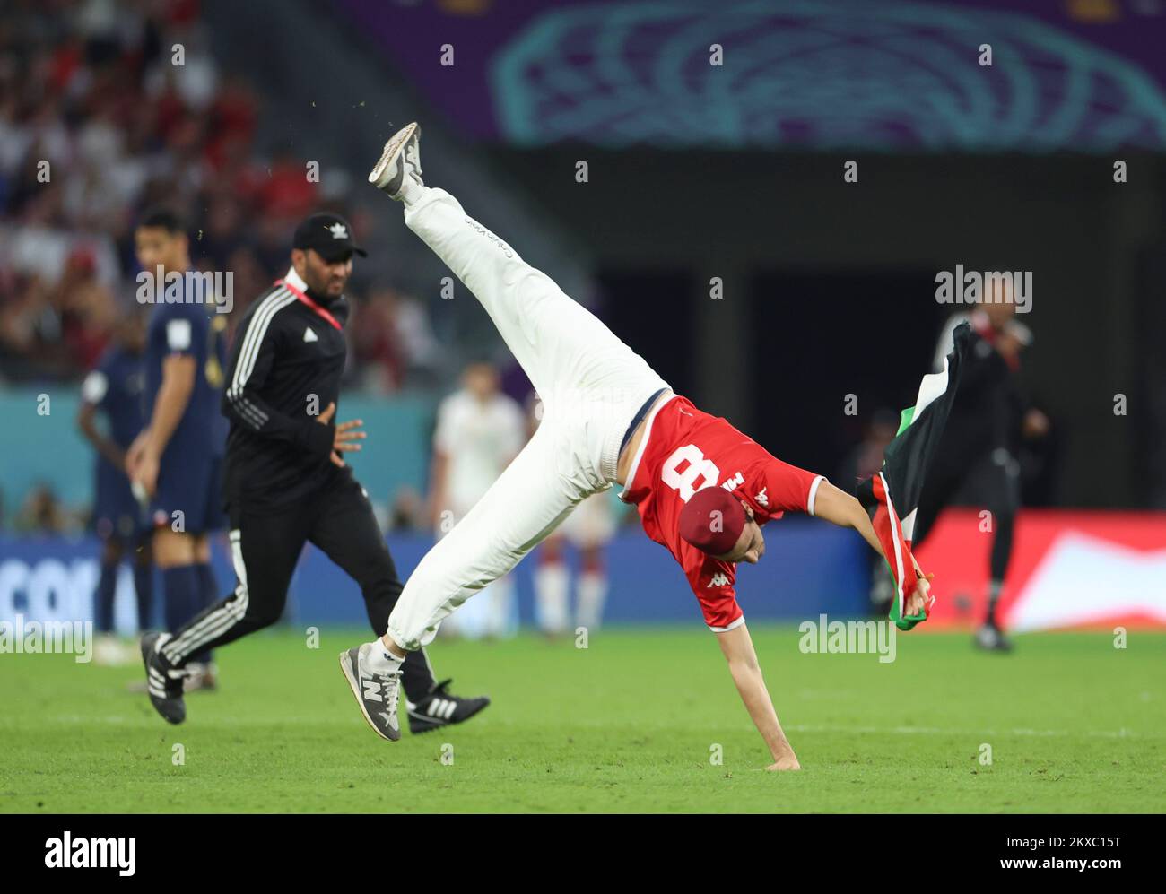 Al Rayyan, Qatar. 30th Nov, 2022. A pitch invader does a flip flop ...