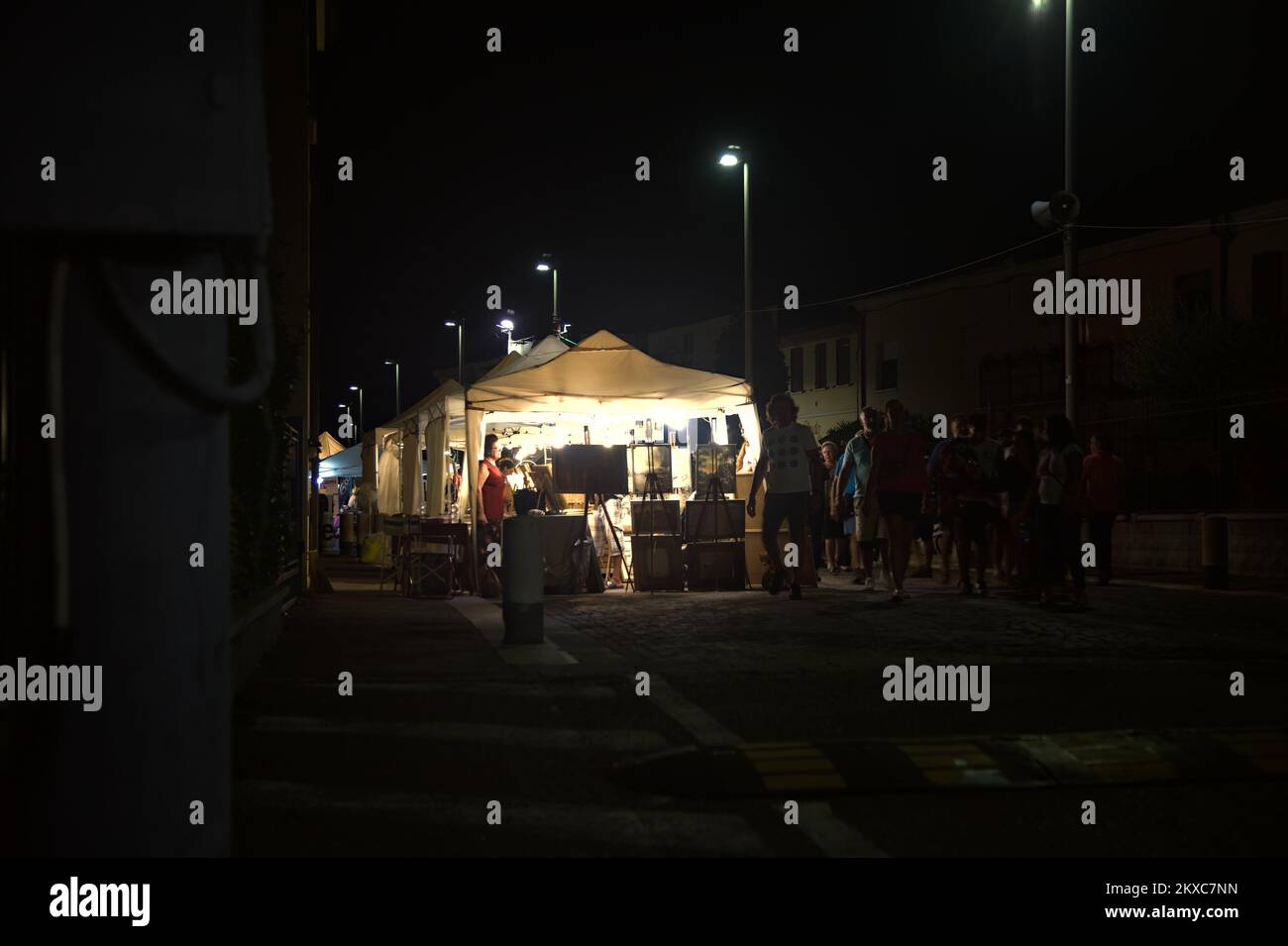 Stalls and crowd of a fair in the italian countryside in summer Stock ...