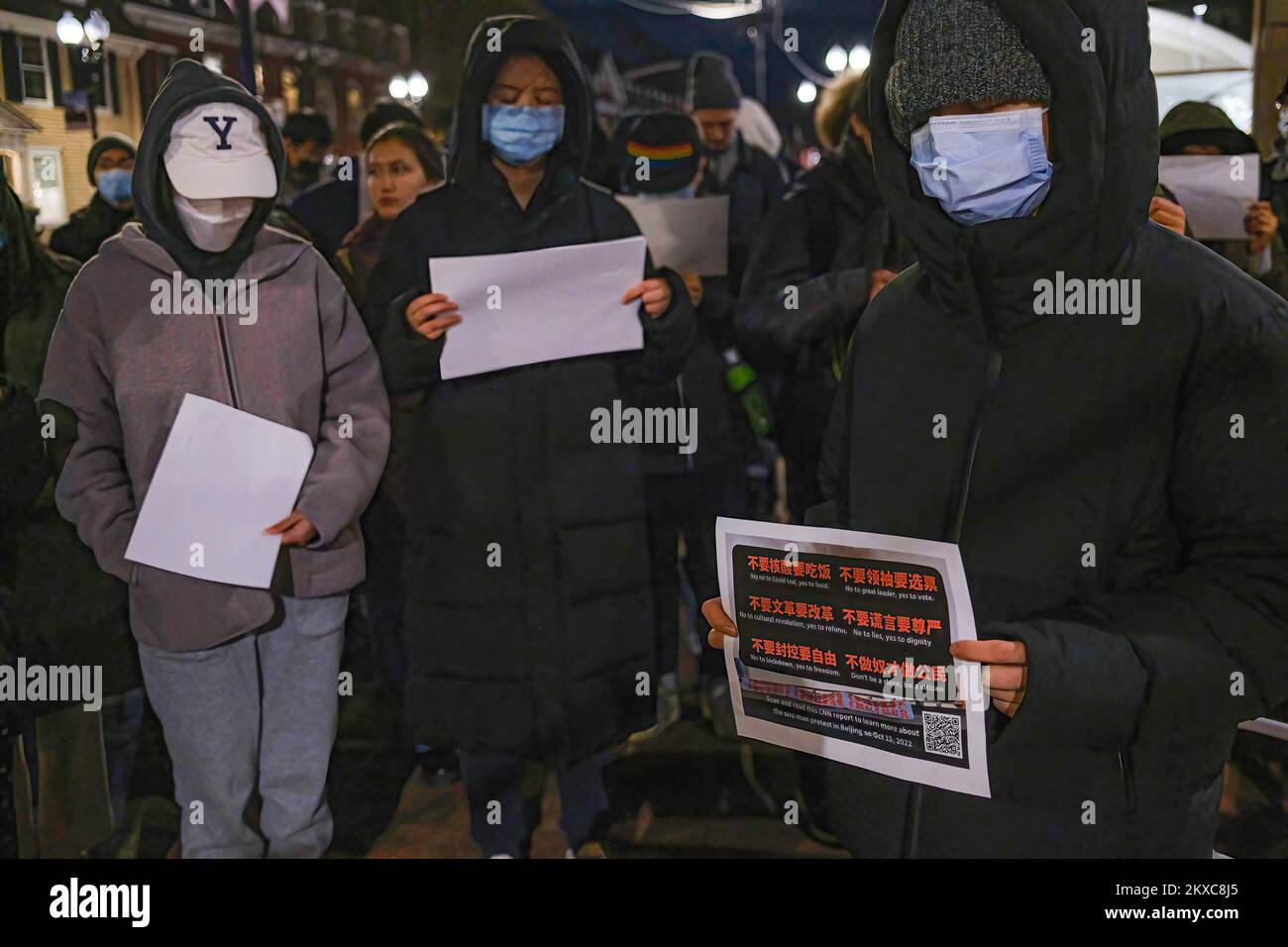 Protesters hold blank papers and placards during a demonstration ...