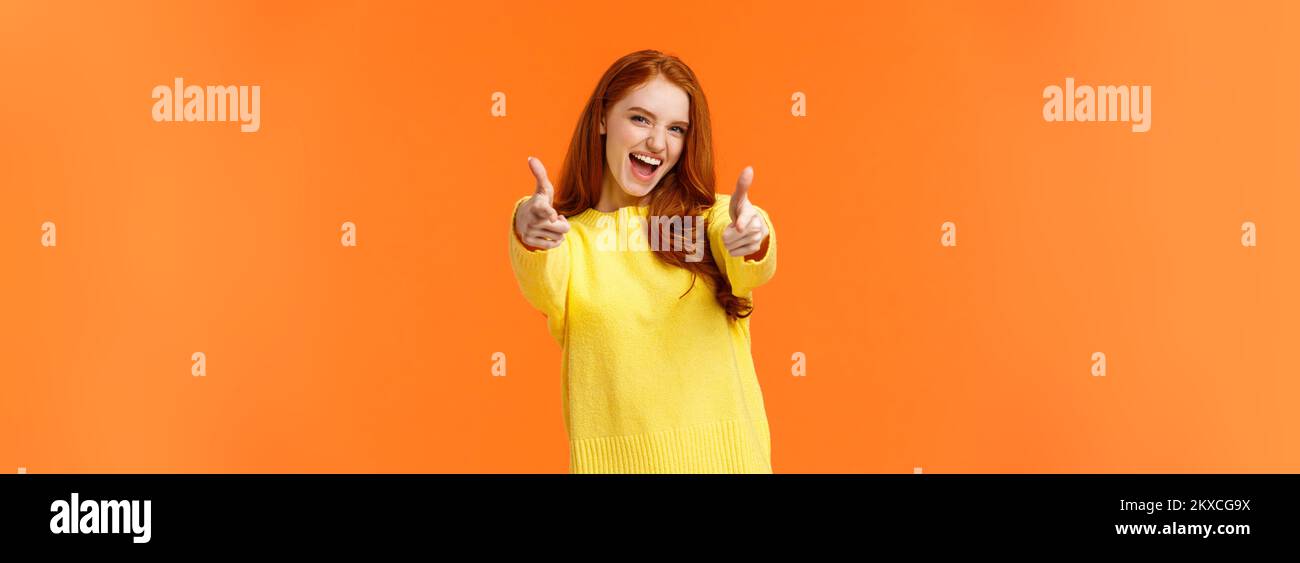 Excited, carefree cool modern hipster girl with red hair showing thumbs ...