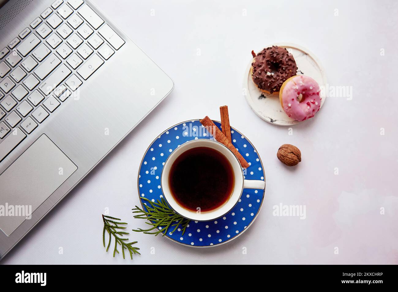 Aesthetics breakfast at home - with cup of coffee, doughnuts and laptop ...