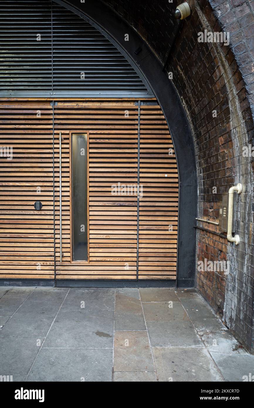 Wooden slats door and wall Stock Photo - Alamy