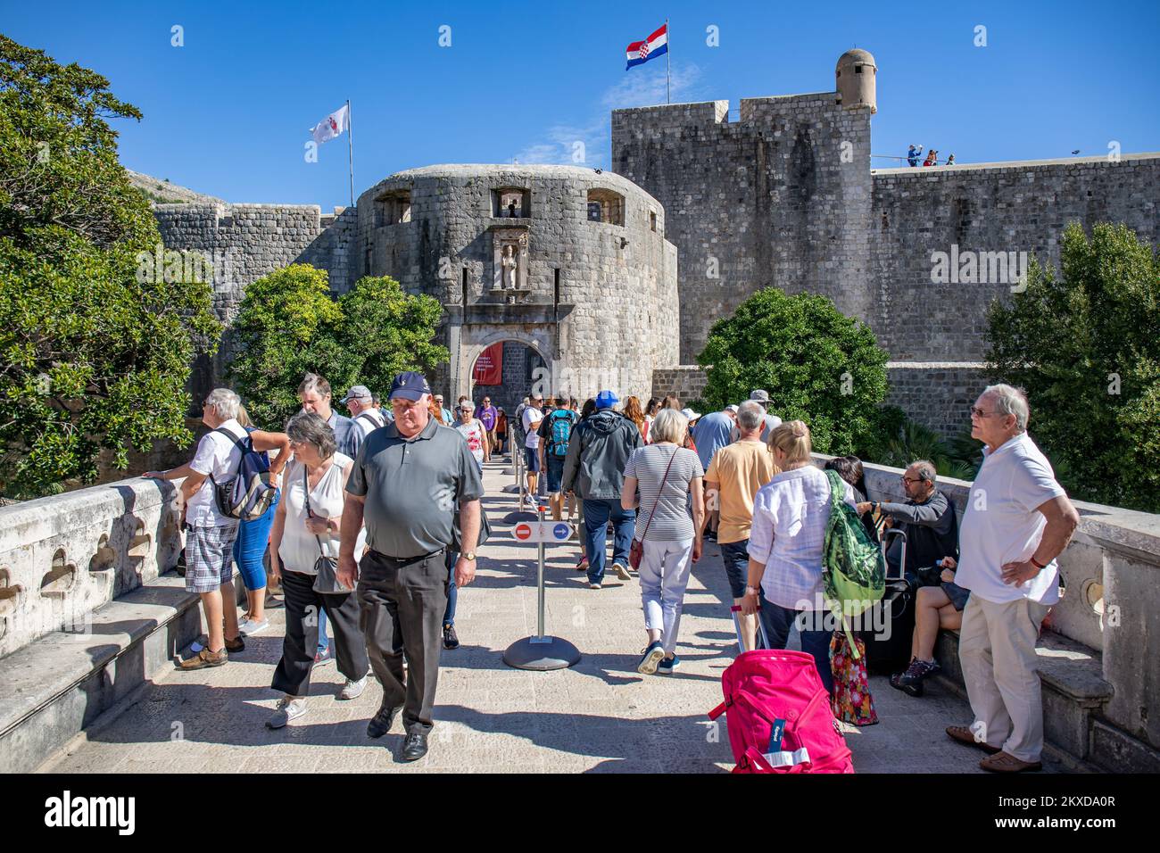 Tourists are seen sightseeing old town on sunny October day in ...