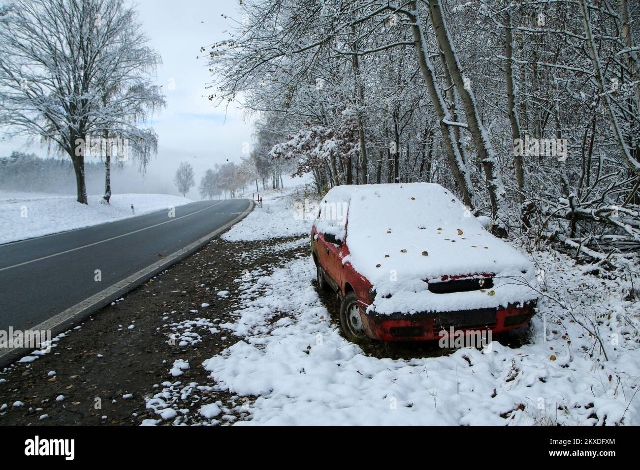 Abandoned car standing by the road. Maybe after the traffic accident or ...