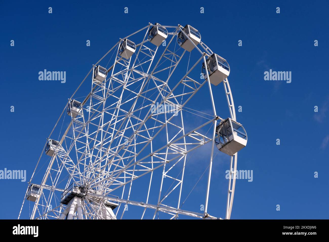 Circle ferris wheel from white metal construction with many rotating ...