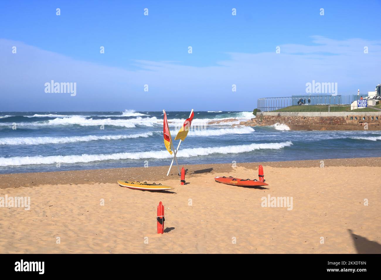 Lifeguard equipment in yellow and red colors and shark danger on the ...